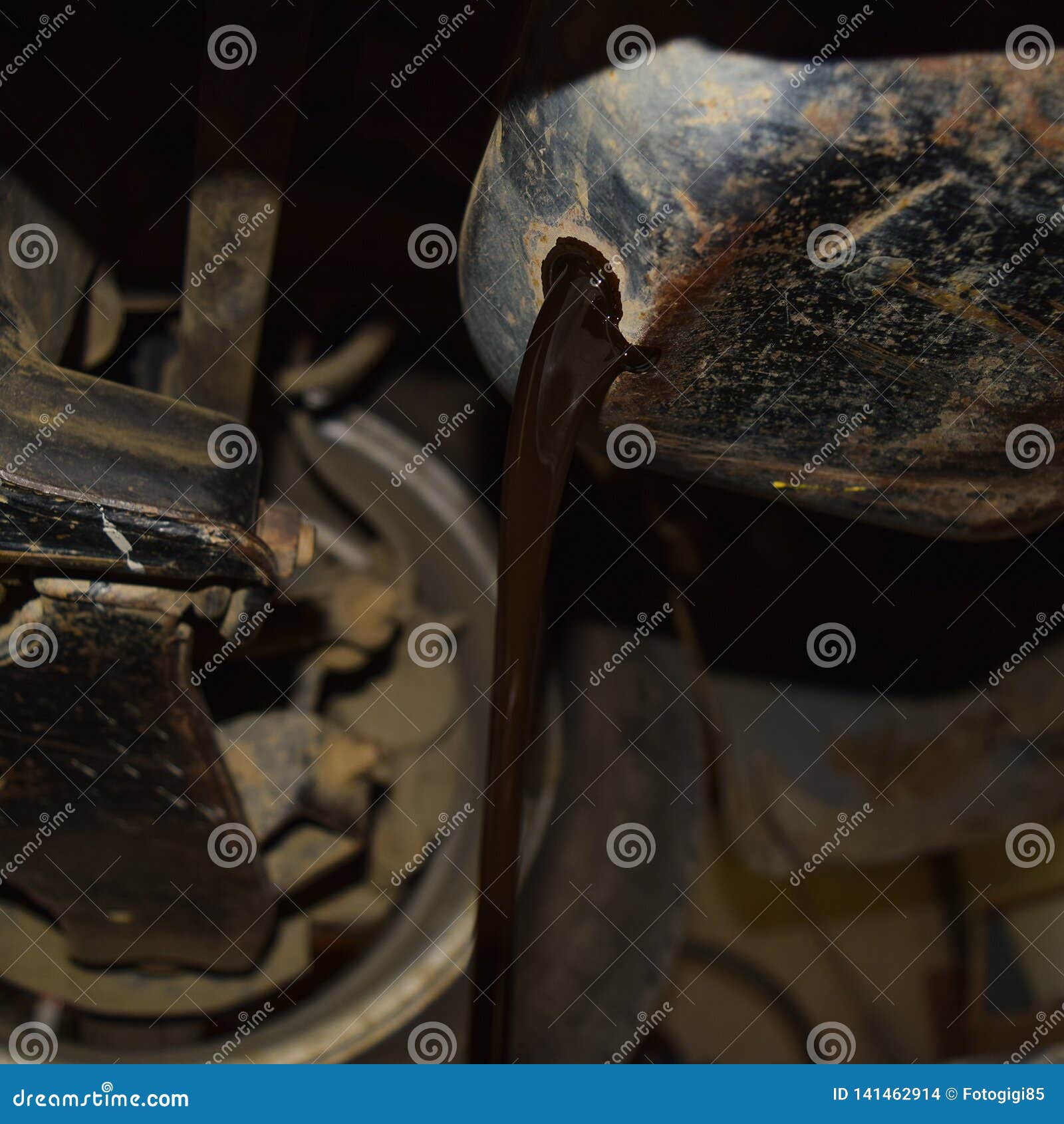 Drain the Old Oil from the Engine through the Drain Plug Stock Photo ...