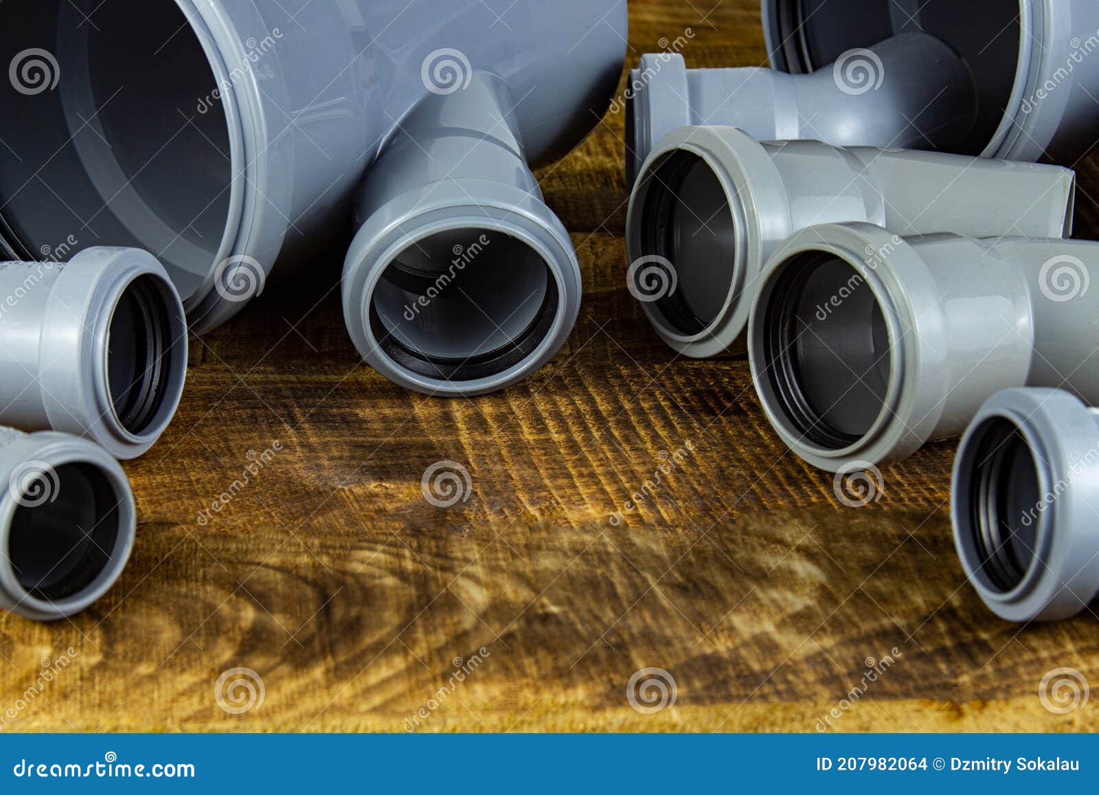 Drain Pipes. Assorted Rebar Gutters on Wooden Background Stock Photo ...