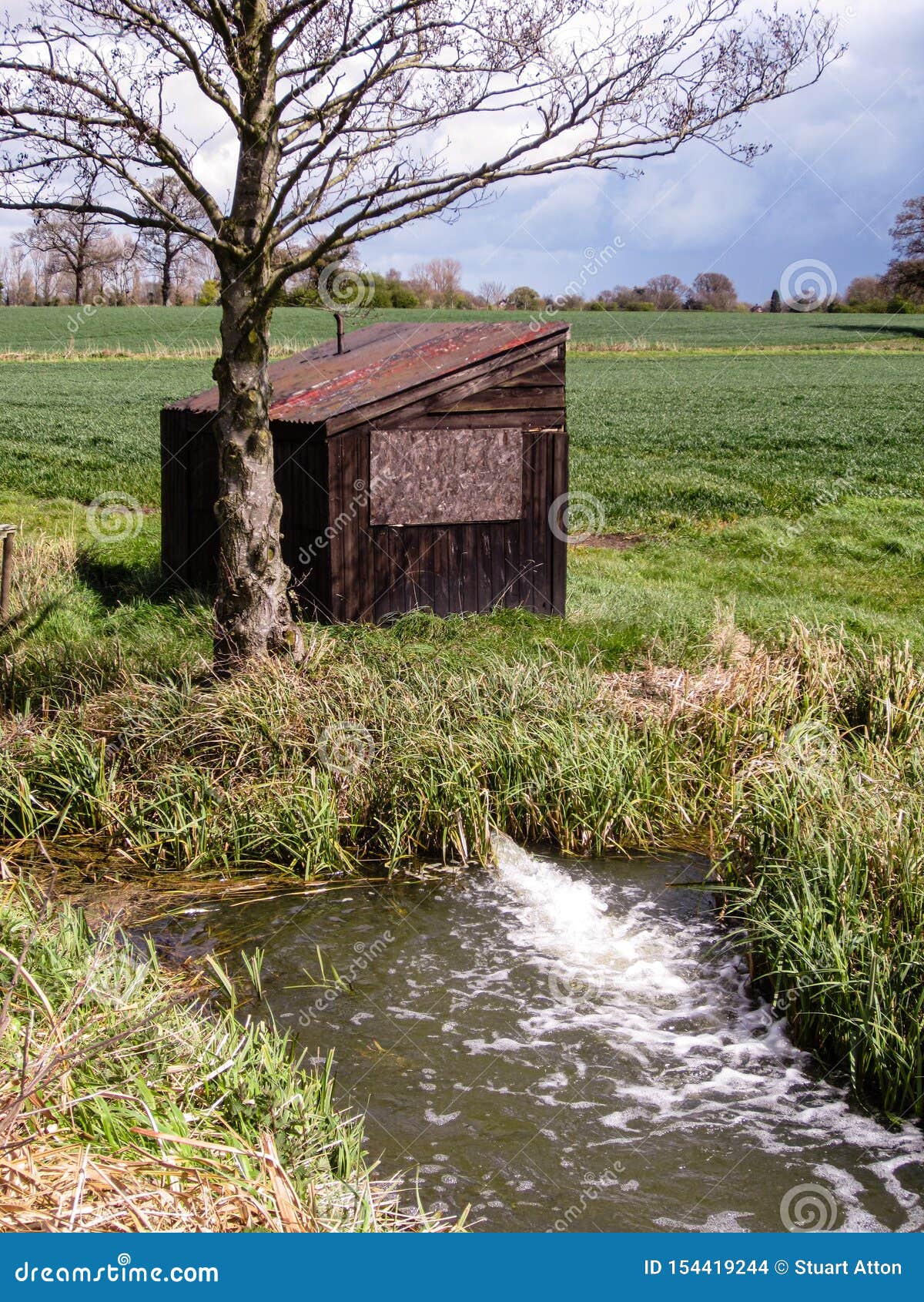 Drainage Ditch and Pump House Stock Photo - Image of water, field ...