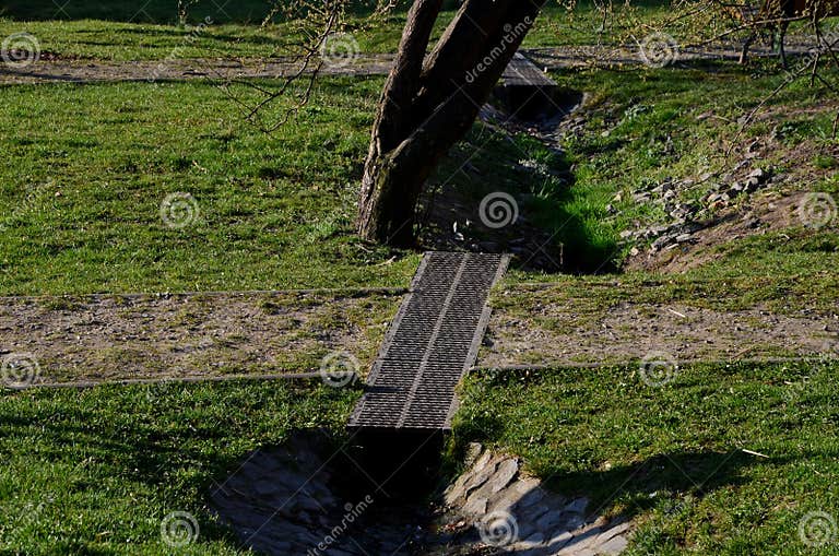 Drainage of the Path by Means of a Gutter Under Which Water Flows. the ...