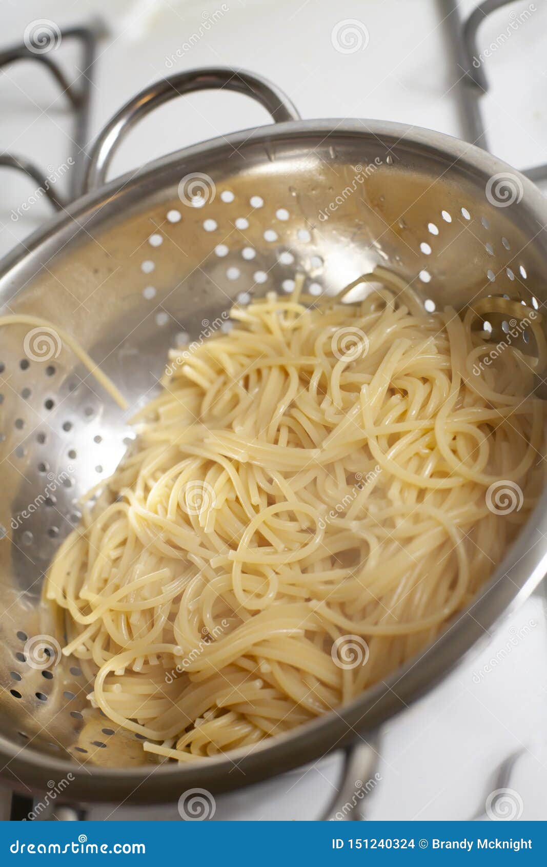 Draining Cooked Spaghetti stock photo. Image of dinner - 151240324