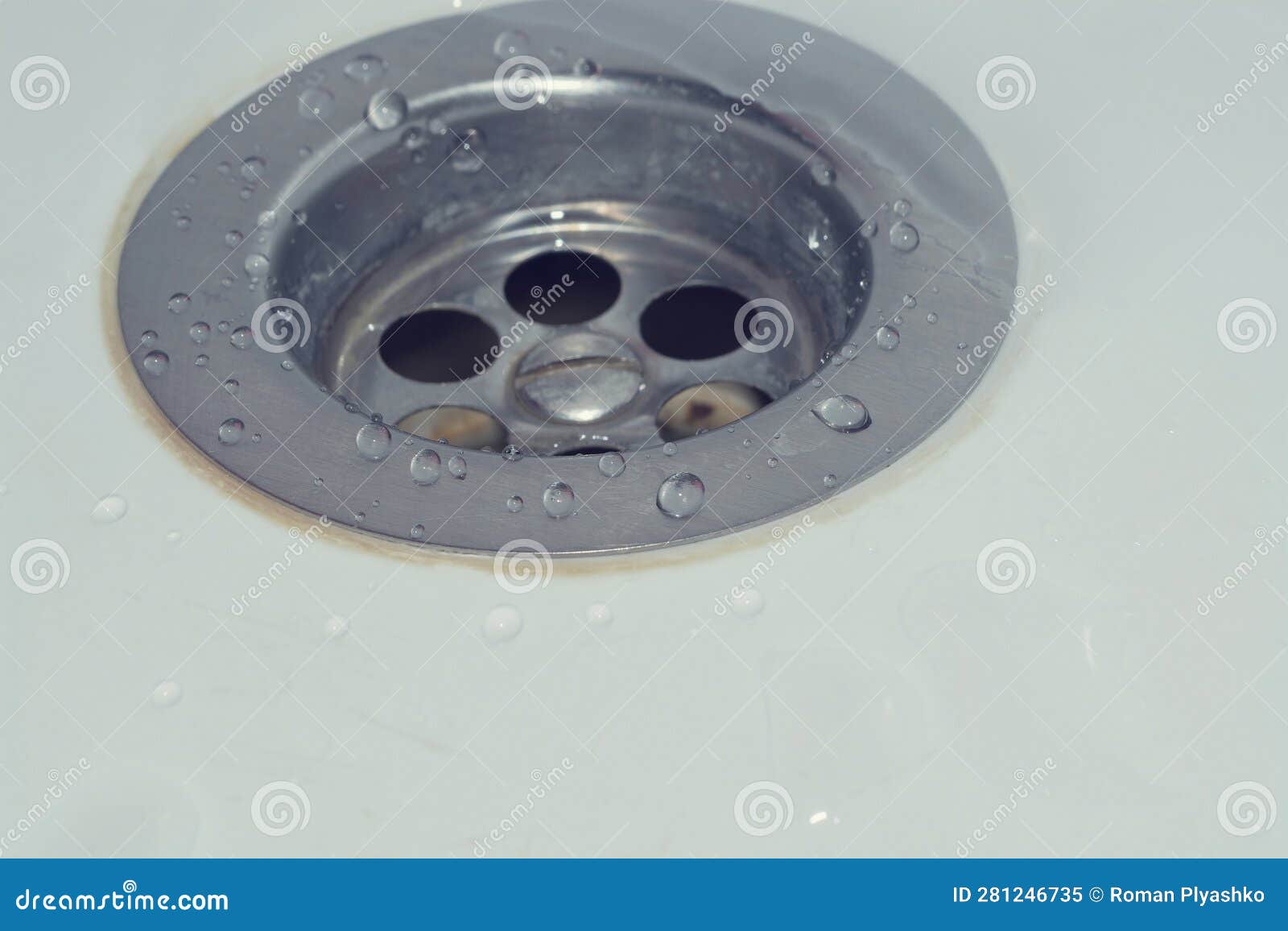 Draining the Water in the Sink. Drops on a White Sink Stock Image ...