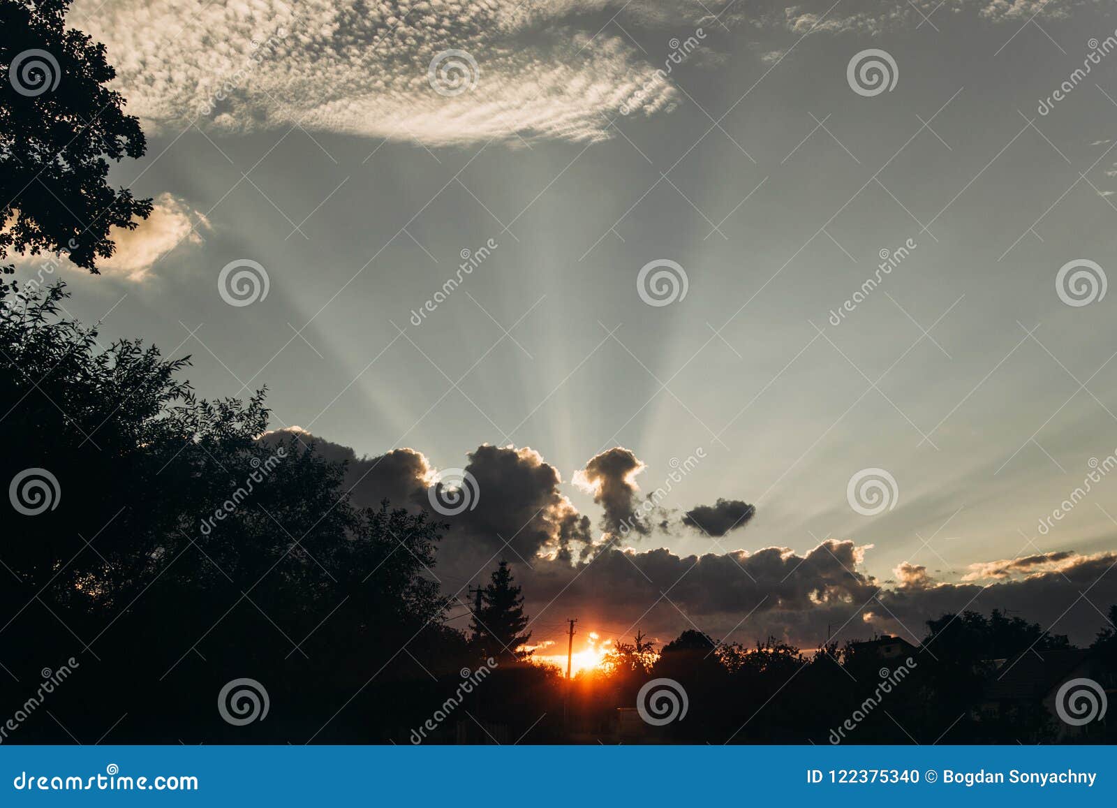 Dramatic Amazing Sun and Sunset Light Rays through Clouds in Sky Stock ...