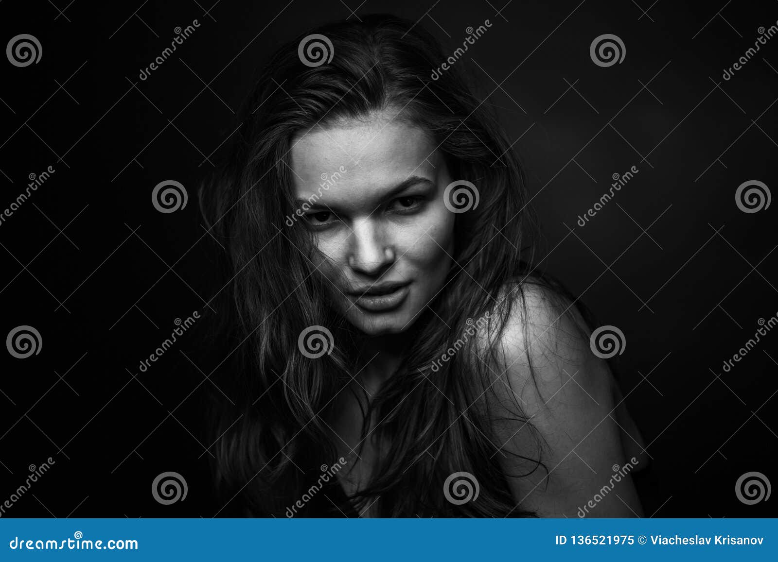 Dramatic Black And White Portrait Of A Beautiful Girl On A Dark