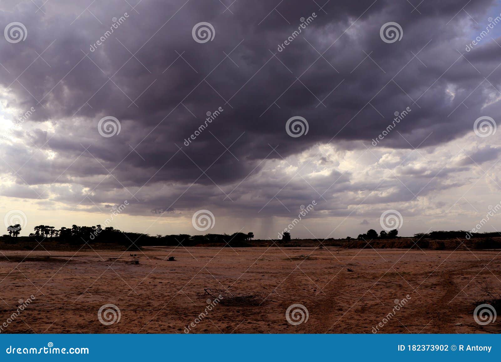 Dramatic Cloud Formations with Dry Land Foreground Stock Photo - Image ...