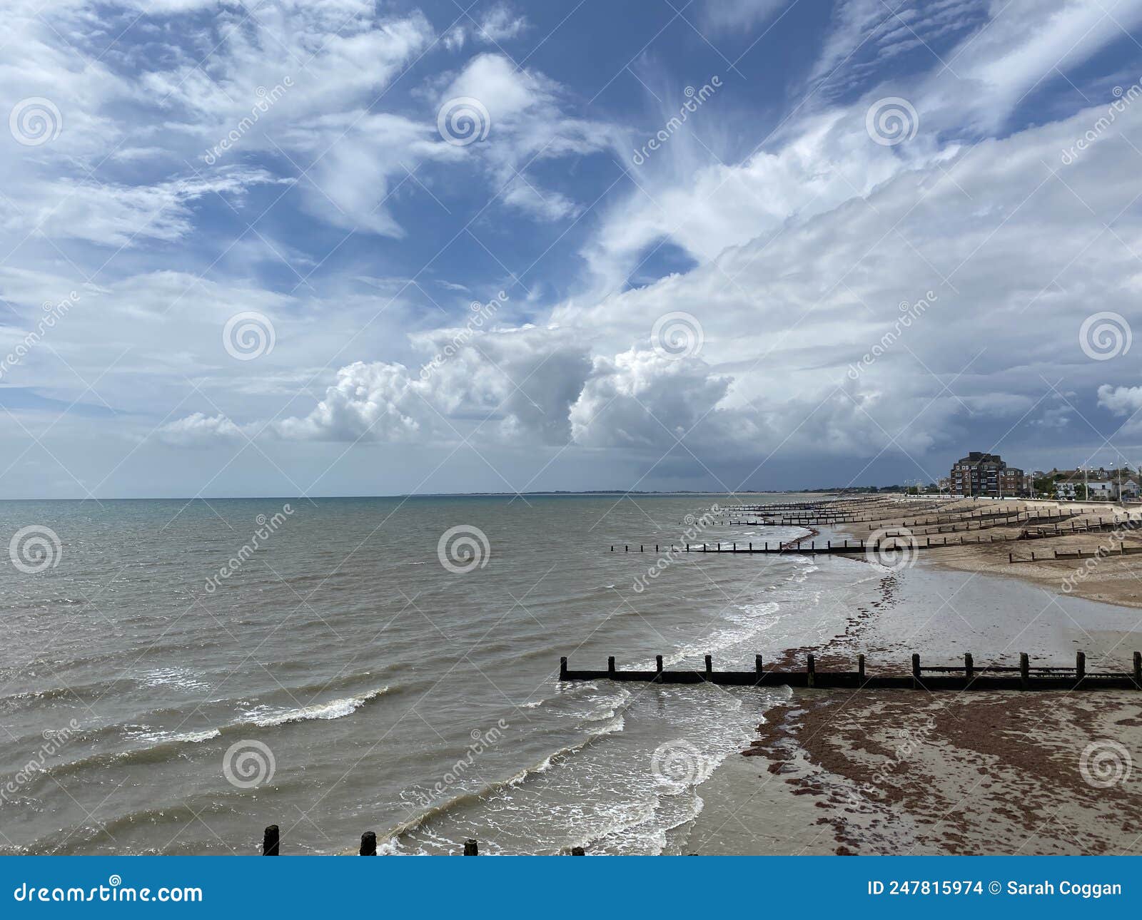 Dramatic Cloud Formations and High Up View Over Beach Looking West ...
