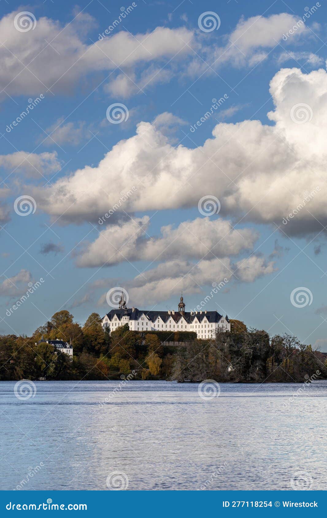 Dramatic Clouds Fly Over the Lake in the Background Ploen Castle, in ...