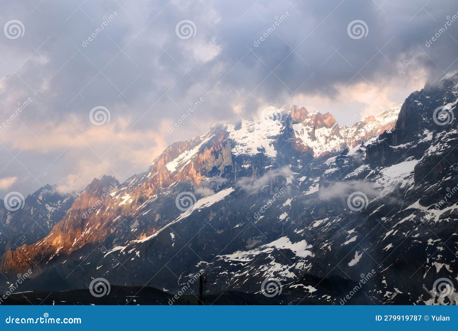 Dramatic Clouds and Light at the Sunrise Time Over the Alps Peaks Stock ...