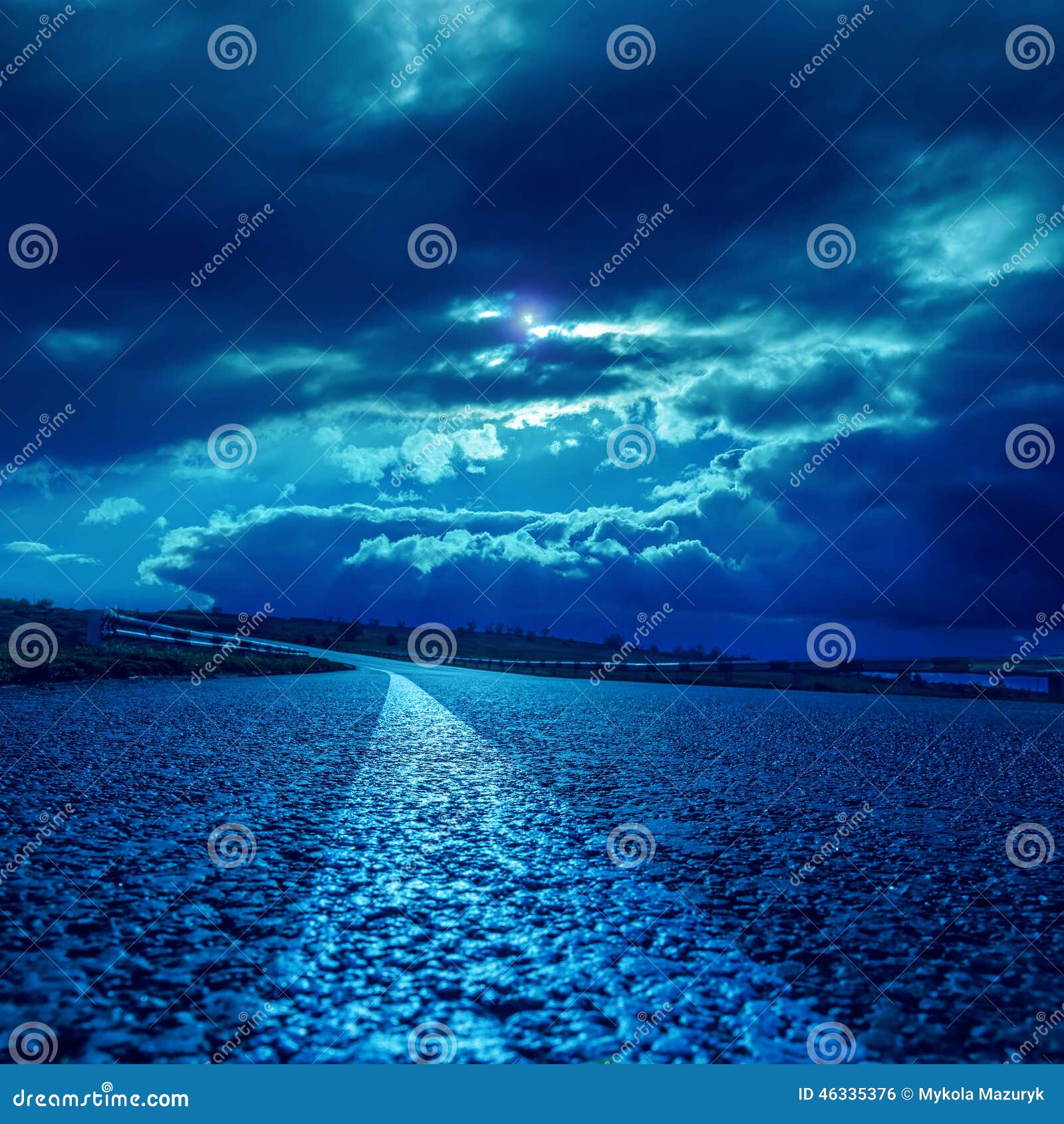 Dramatic Clouds Over Asphalt Road in Dark Moonlight Stock Photo - Image ...