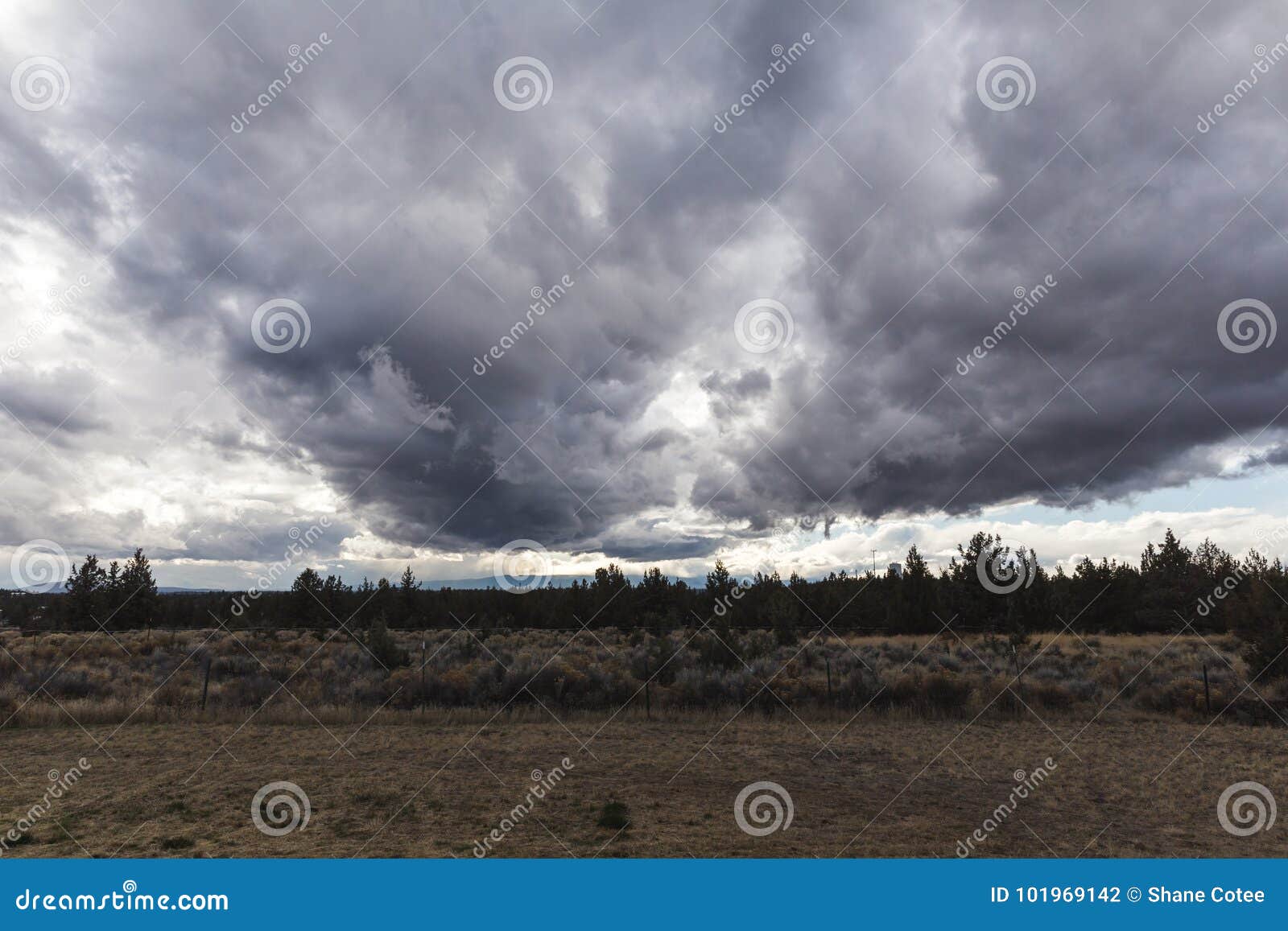 Dramatic Clouds Over Desert Landscape Stock Photo - Image of terrebonne ...