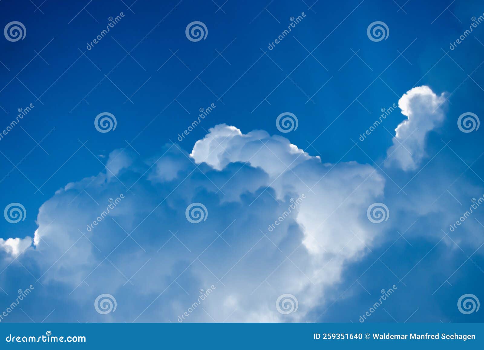 Bright Sunlight Rays in Blue Sky with Luminous Clouds. Stock Photo ...