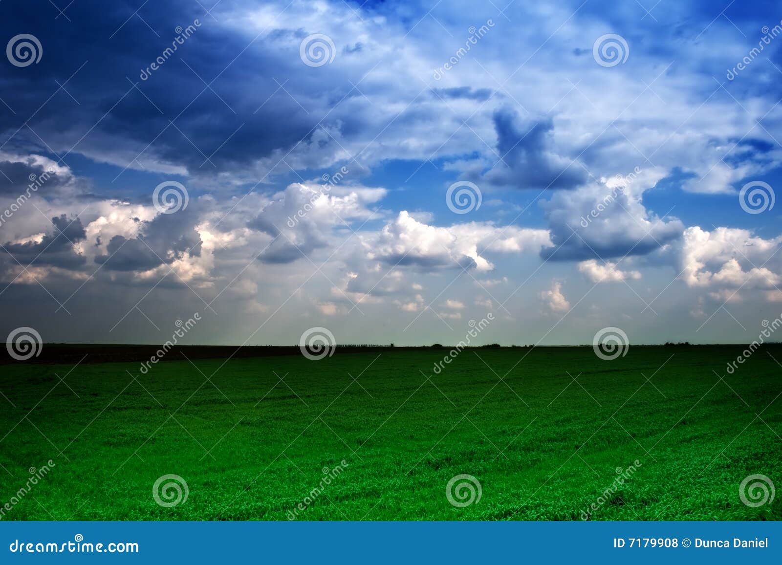 Dramatic Cloudy Sky and Green Field Stock Photo - Image of grassland ...