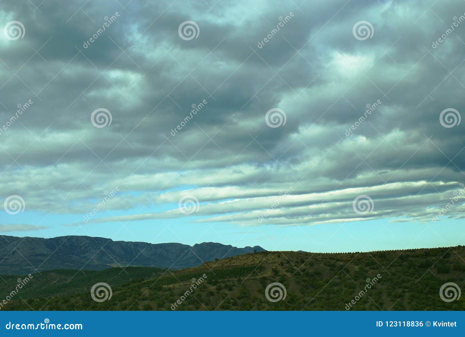 Dramatic Cloudy Sky with Light Horizon Over Mountains Stock Photo ...