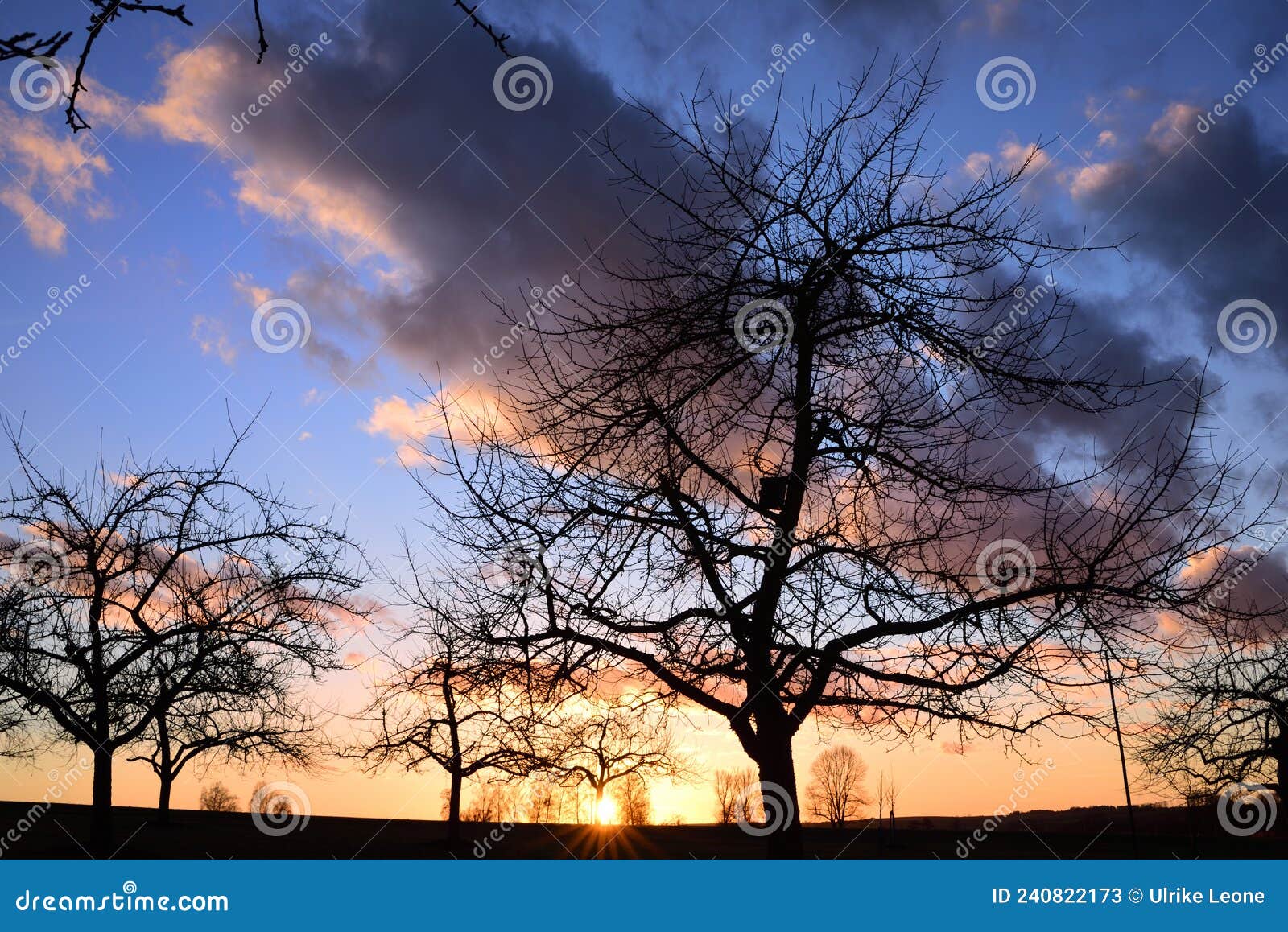 Dramatic Cloudy Sky at Sunset and Lots of Clouds. in the Foreground are ...