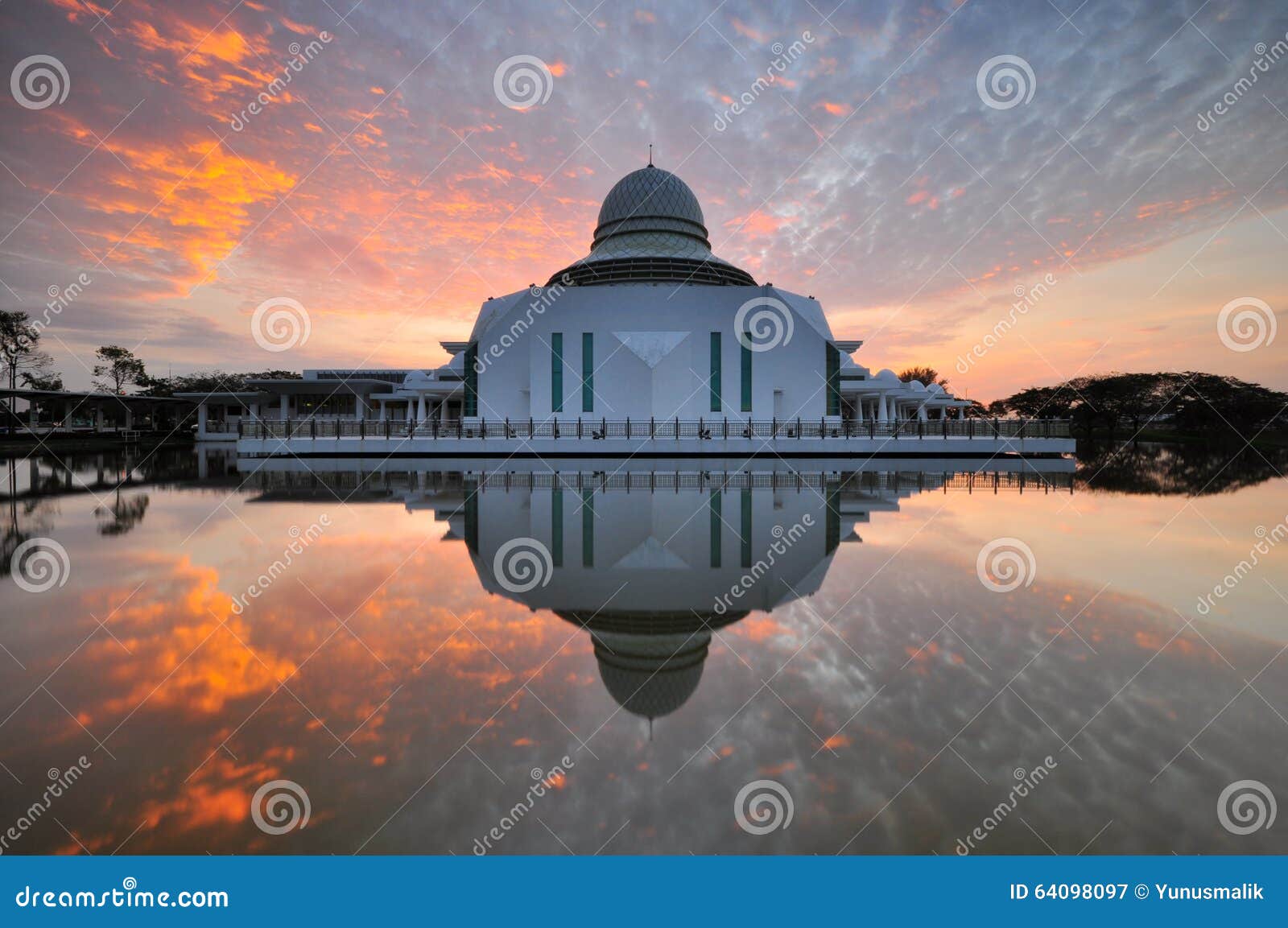 Dramatic Cloudy Sunrise Over White Floating Mosque. Stock Image - Image ...