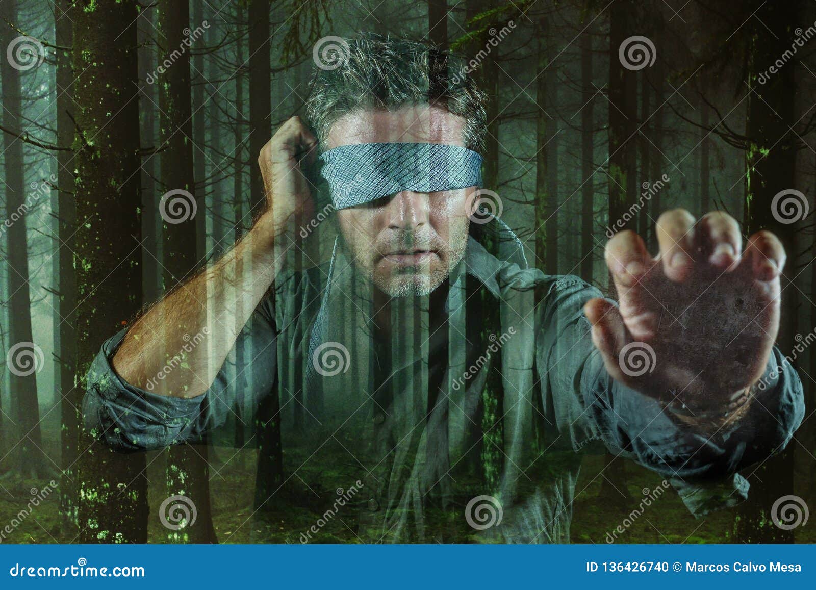 Young Confused and Scared Man Blindfolded with Necktie Playing Internet ...