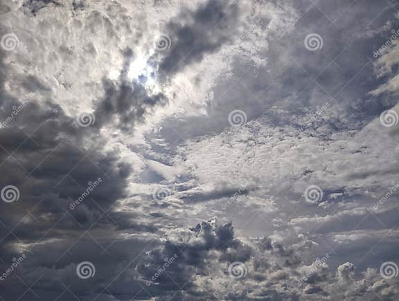 Dramatic Dark Clouds with Sun Shining Behind it, Irregular Clouds in ...