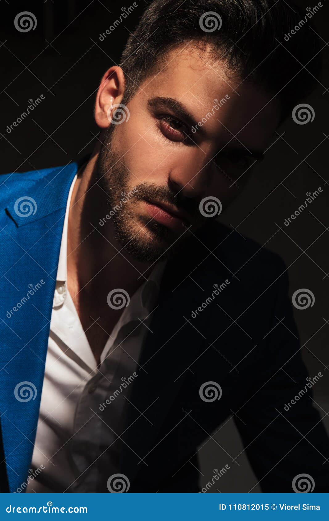 Dramatic Elegant Young Man with Ray of Light on Face Stock Image ...