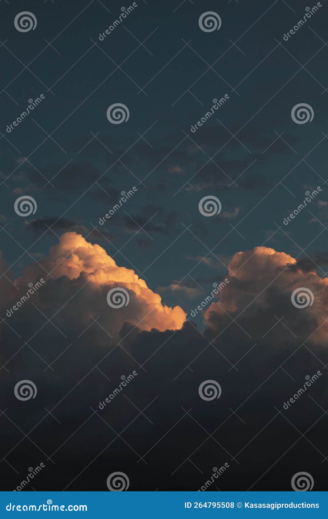 Dramatic Fluffy Backlit Clouds on a Dark Sky, Vertical Stock Photo ...