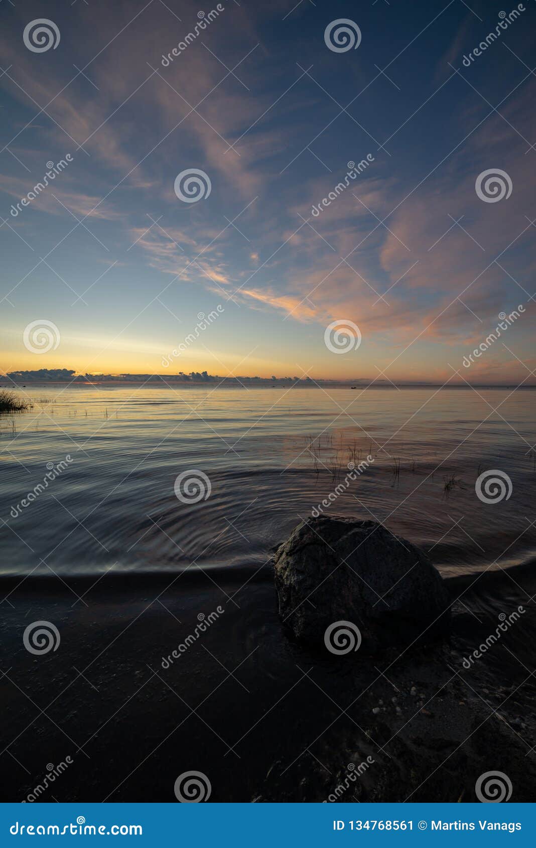Dramatic High Contrast Clouds in Sunset Over Seaside Beach Stock Image ...