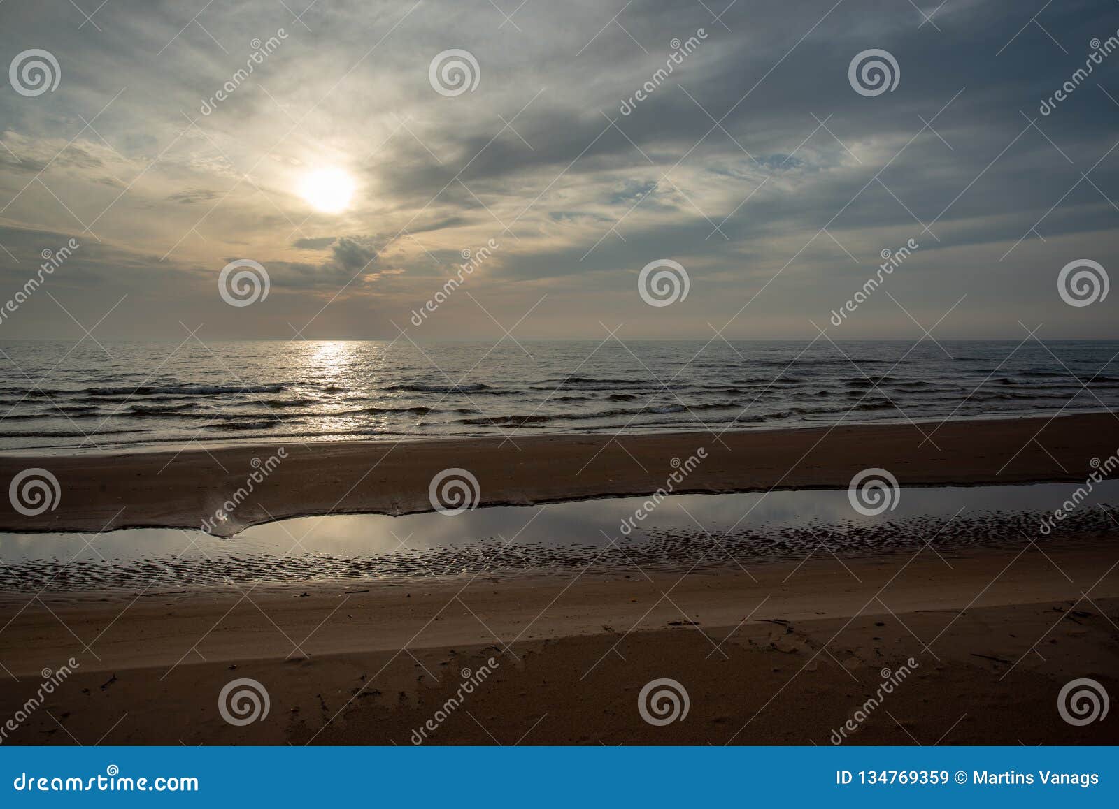 Dramatic High Contrast Clouds in Sunset Over Seaside Beach Stock Image ...