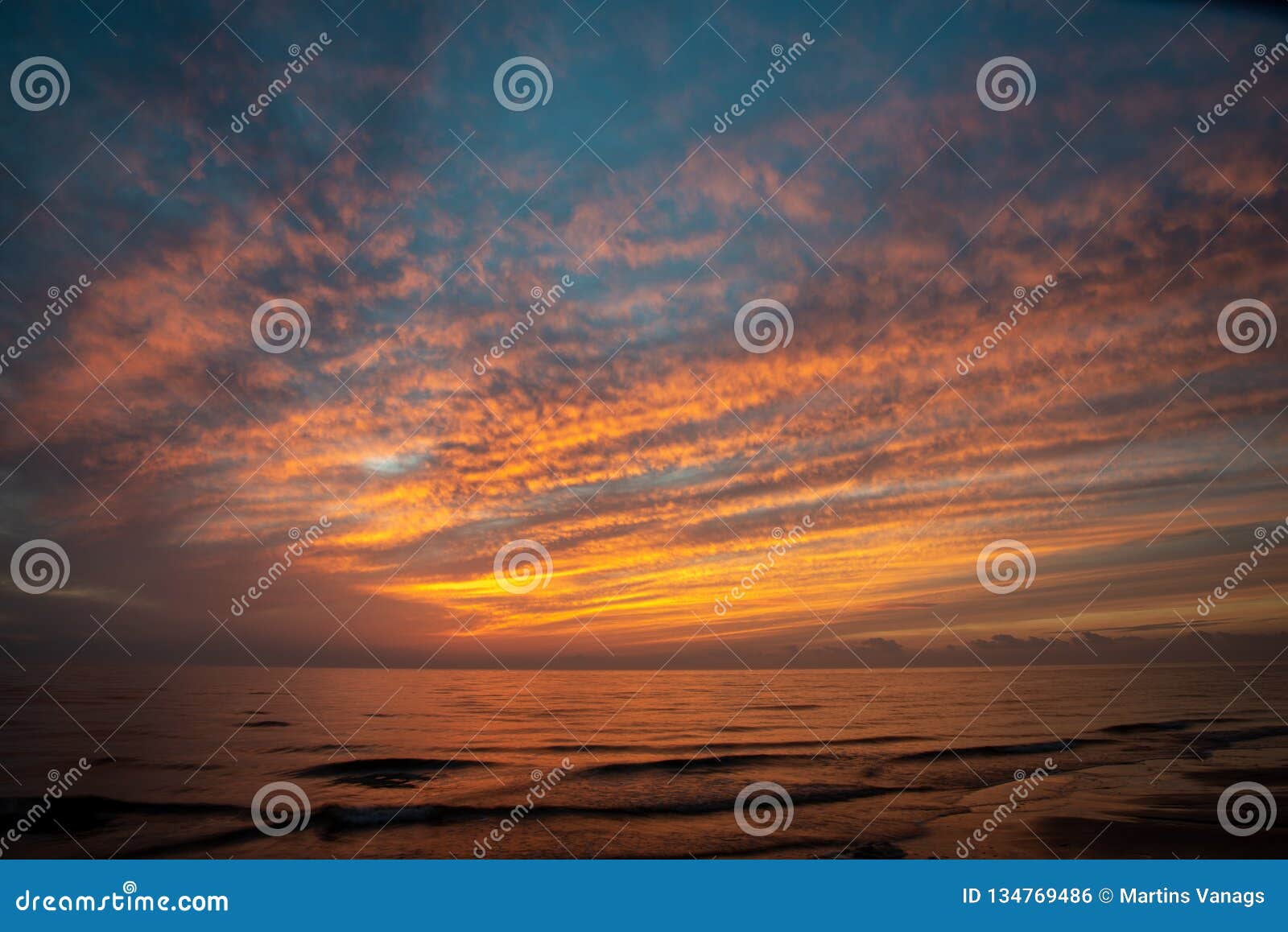 Dramatic High Contrast Clouds in Sunset Over Seaside Beach Stock Photo ...