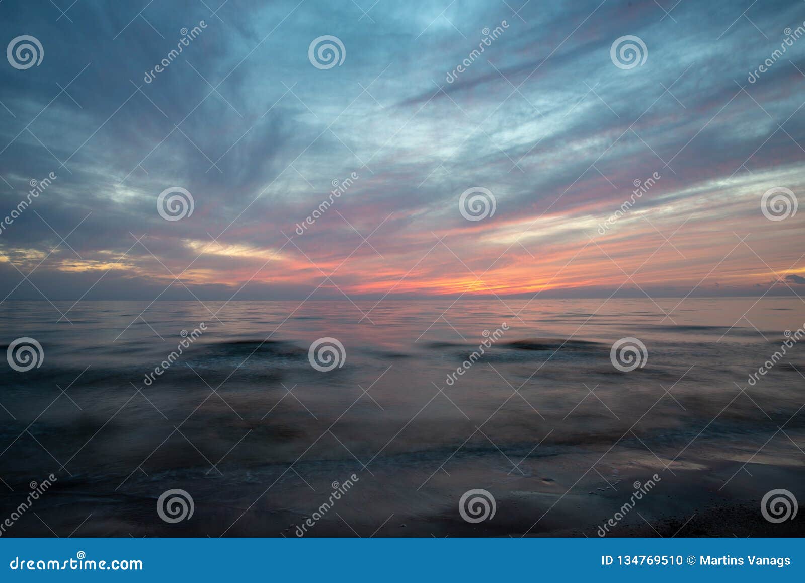 Dramatic High Contrast Clouds in Sunset Over Seaside Beach Stock Photo ...