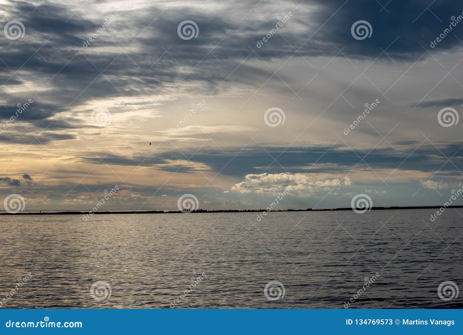 Dramatic High Contrast Clouds in Sunset Over Seaside Beach Stock Image ...