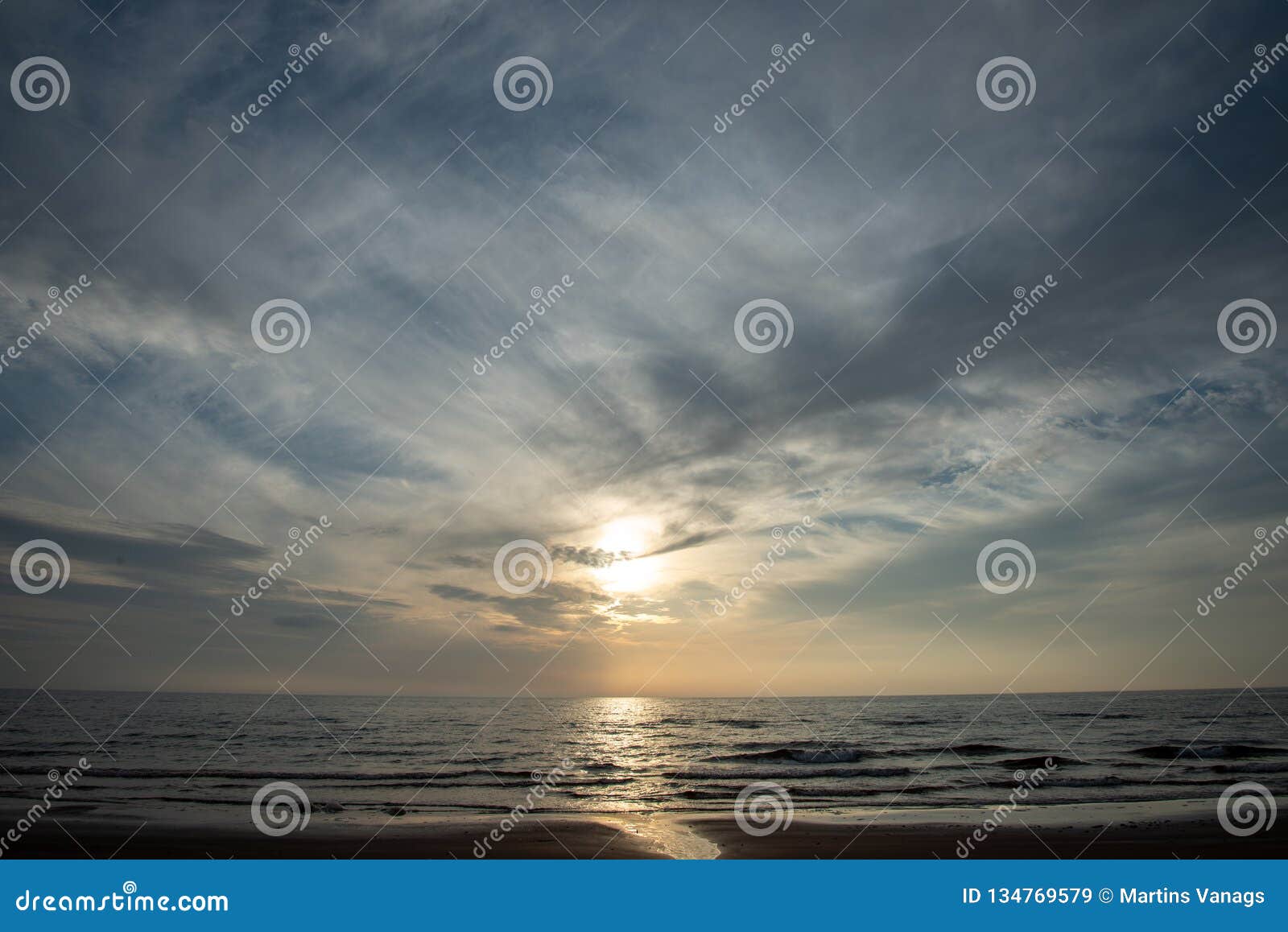 Dramatic High Contrast Clouds in Sunset Over Seaside Beach Stock Image ...