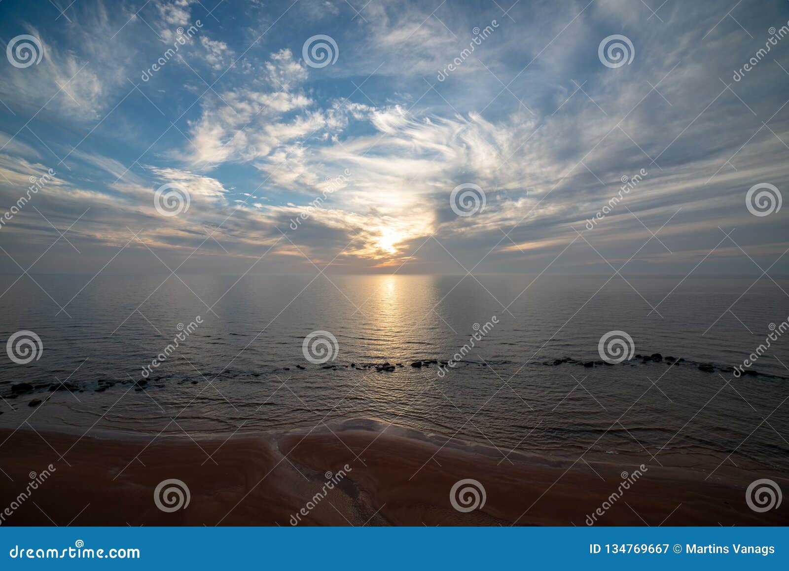 Dramatic High Contrast Clouds in Sunset Over Seaside Beach Stock Image ...