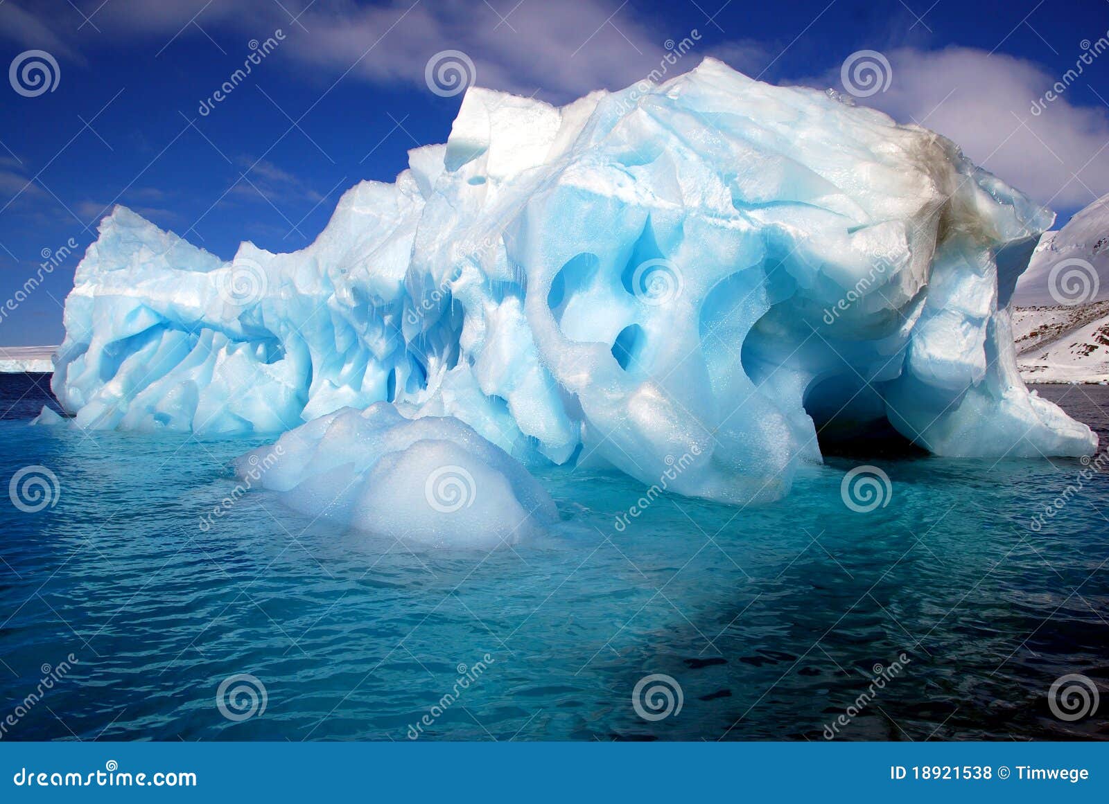 Dramatic Hollowed Out Iceberg in Sea Stock Photo - Image of freeze ...