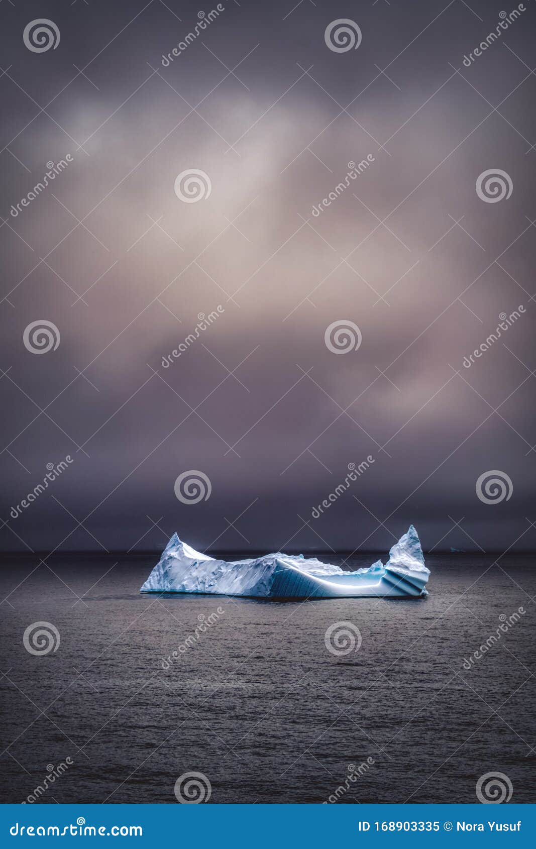 Dramatic Image of an Iceberg Floating Stock Image - Image of cloudy ...