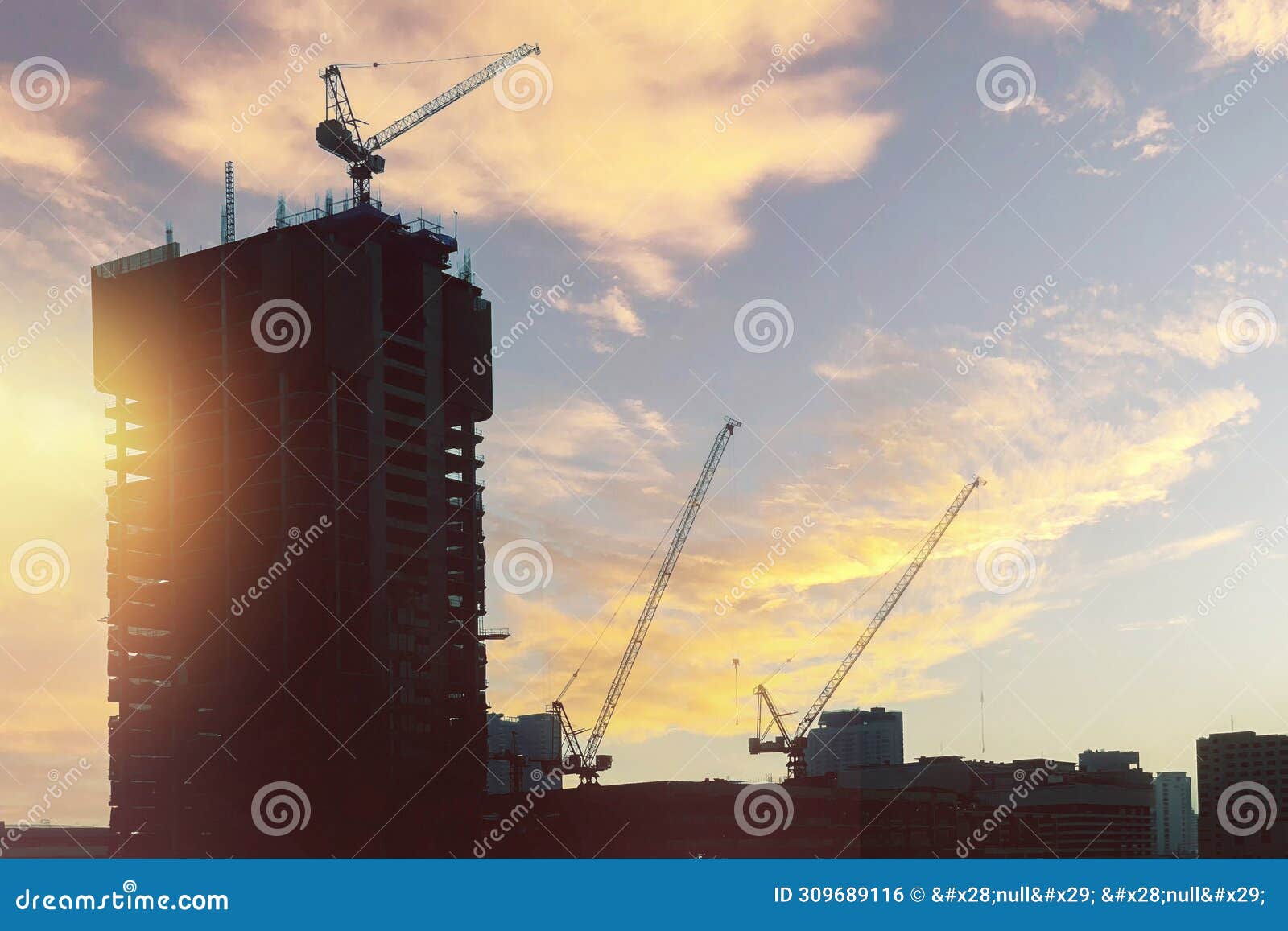 Dramatic Image of Silhouette Architectural Building at Construction Site with Tower Cranes on ...