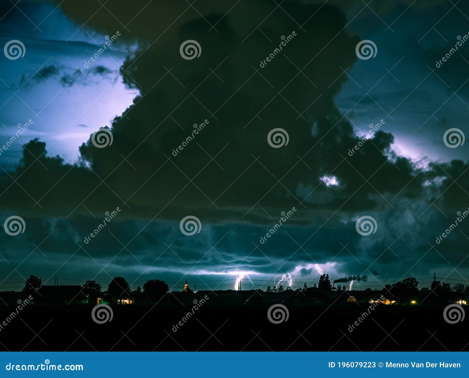 Lightning Strikes Down from a Distant Thundercloud Stock Image - Image ...