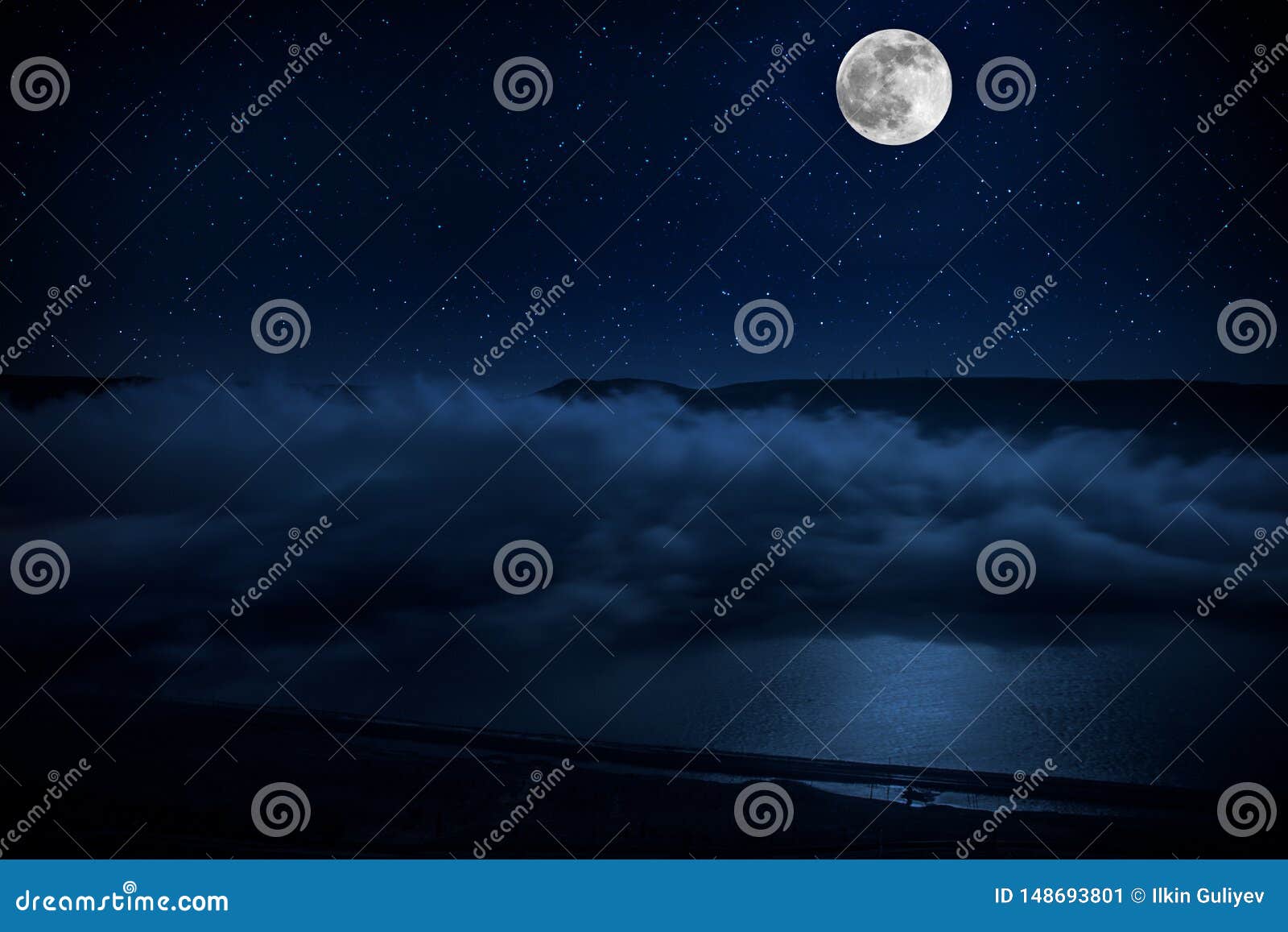 This Dramatic Moon Rise in a Deep Blue Night Time Sky is Accented by ...