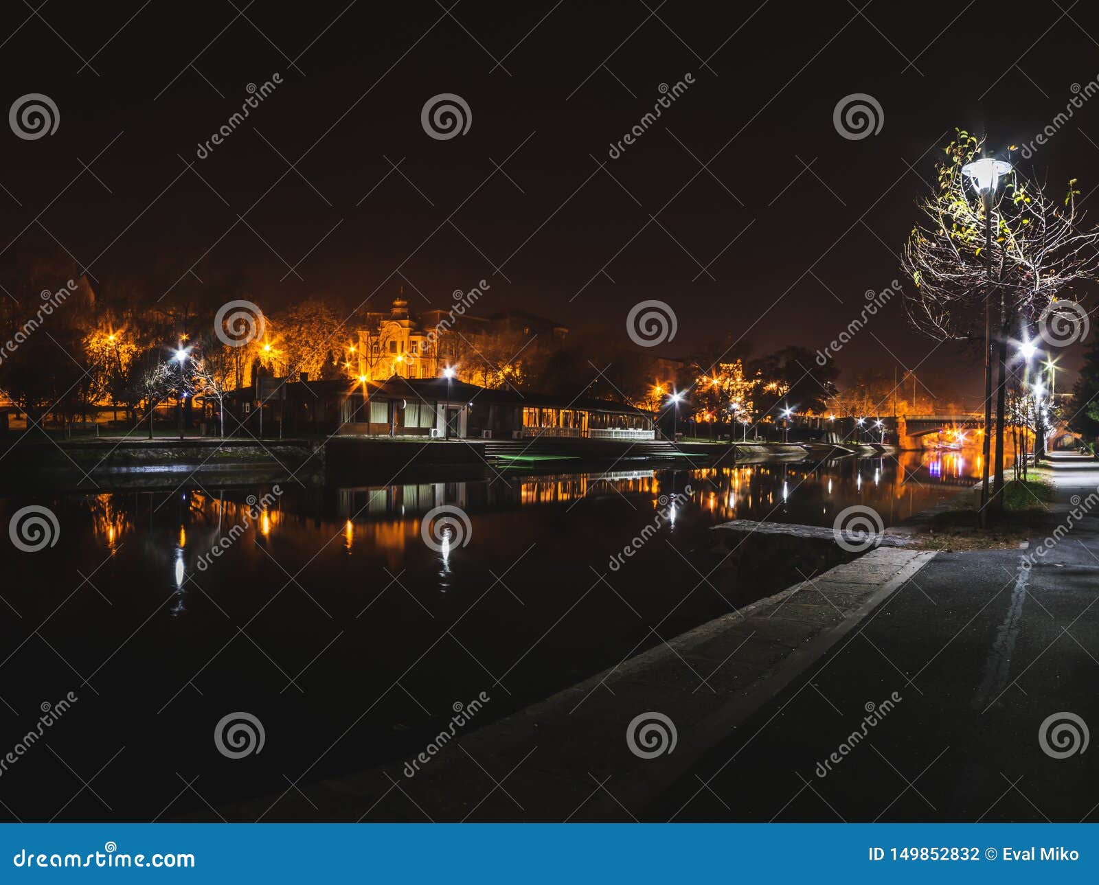 Night Time in Timisoara Park by the River with Reflections and Bridge ...