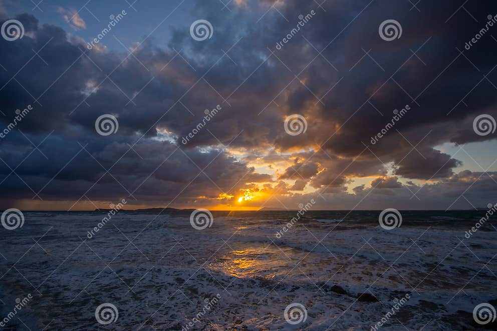 Dramatic Ocean Sunset with Golden Reflections. Stock Photo - Image of ...