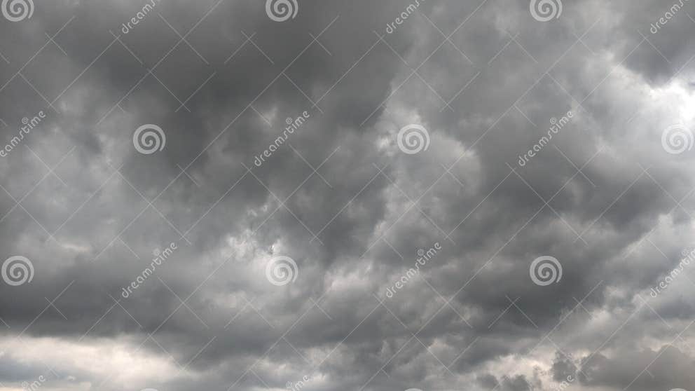 A Dramatic, Overcast Sky with a Single Beam of Sunlight Piercing through the Clouds. the Dark ...