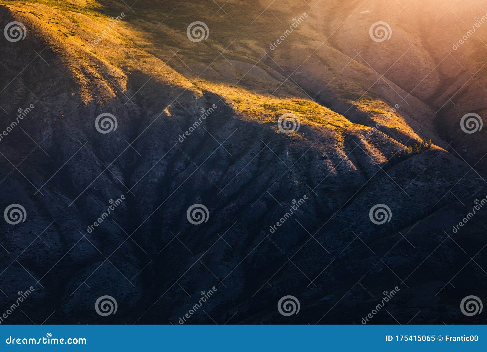 Dramatic Play of Light and Shadow on the Slope of a Large Hill or ...