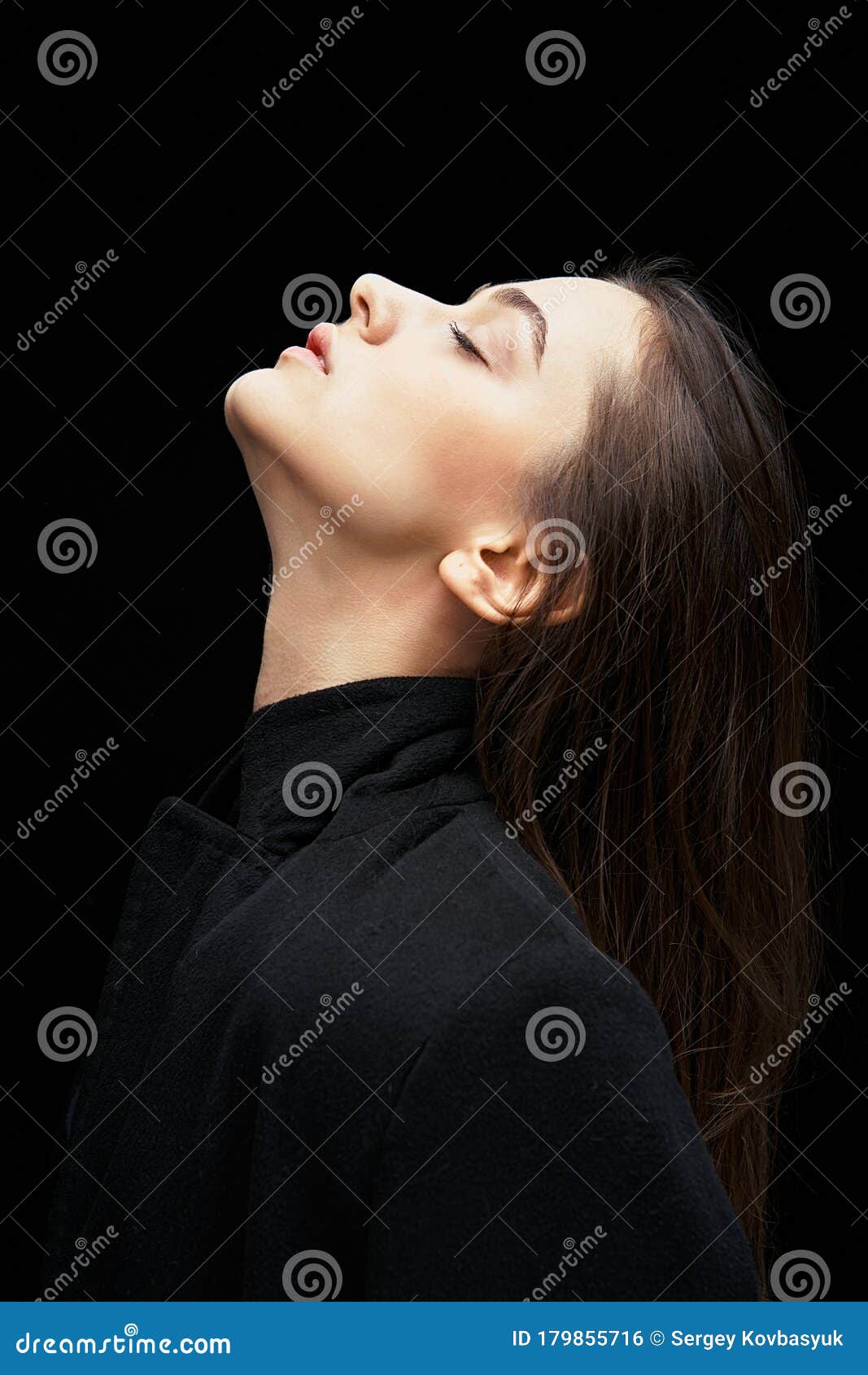 Dramatic Portrait Of A Beautiful Lonely Girl Isolated On A Dark