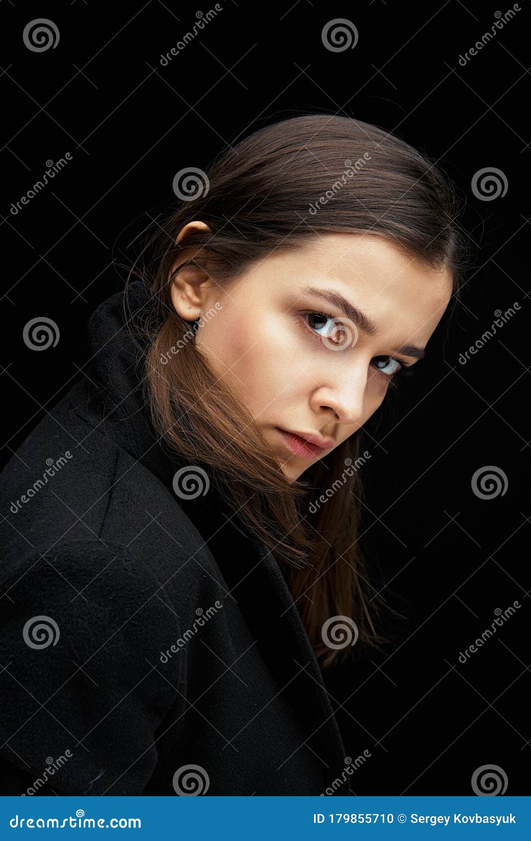 Dramatic Portrait Of A Beautiful Lonely Girl Isolated On A Dark