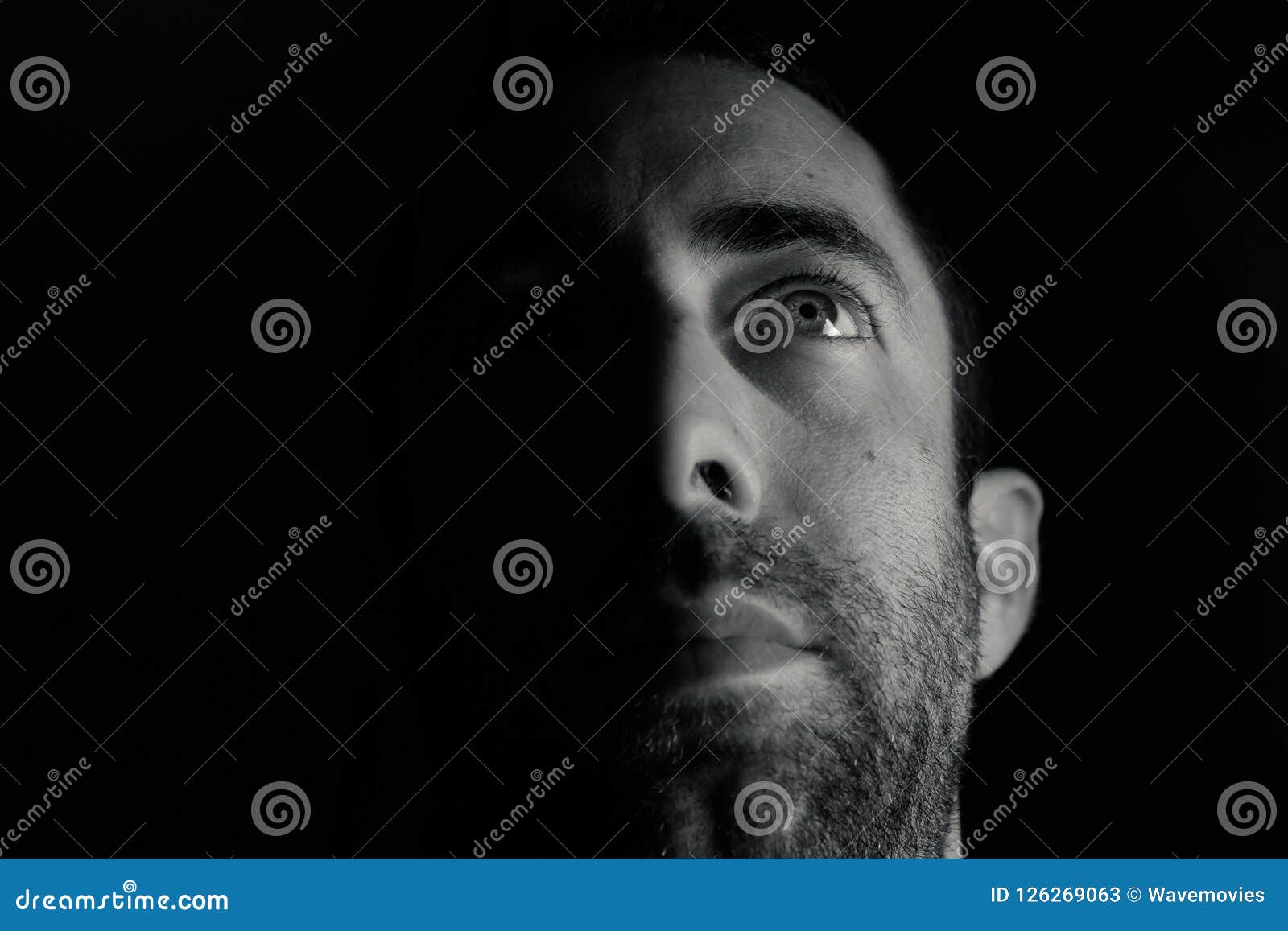 Dramatic Portrait of a Young Man Half Expressionless Face in Dee Stock ...