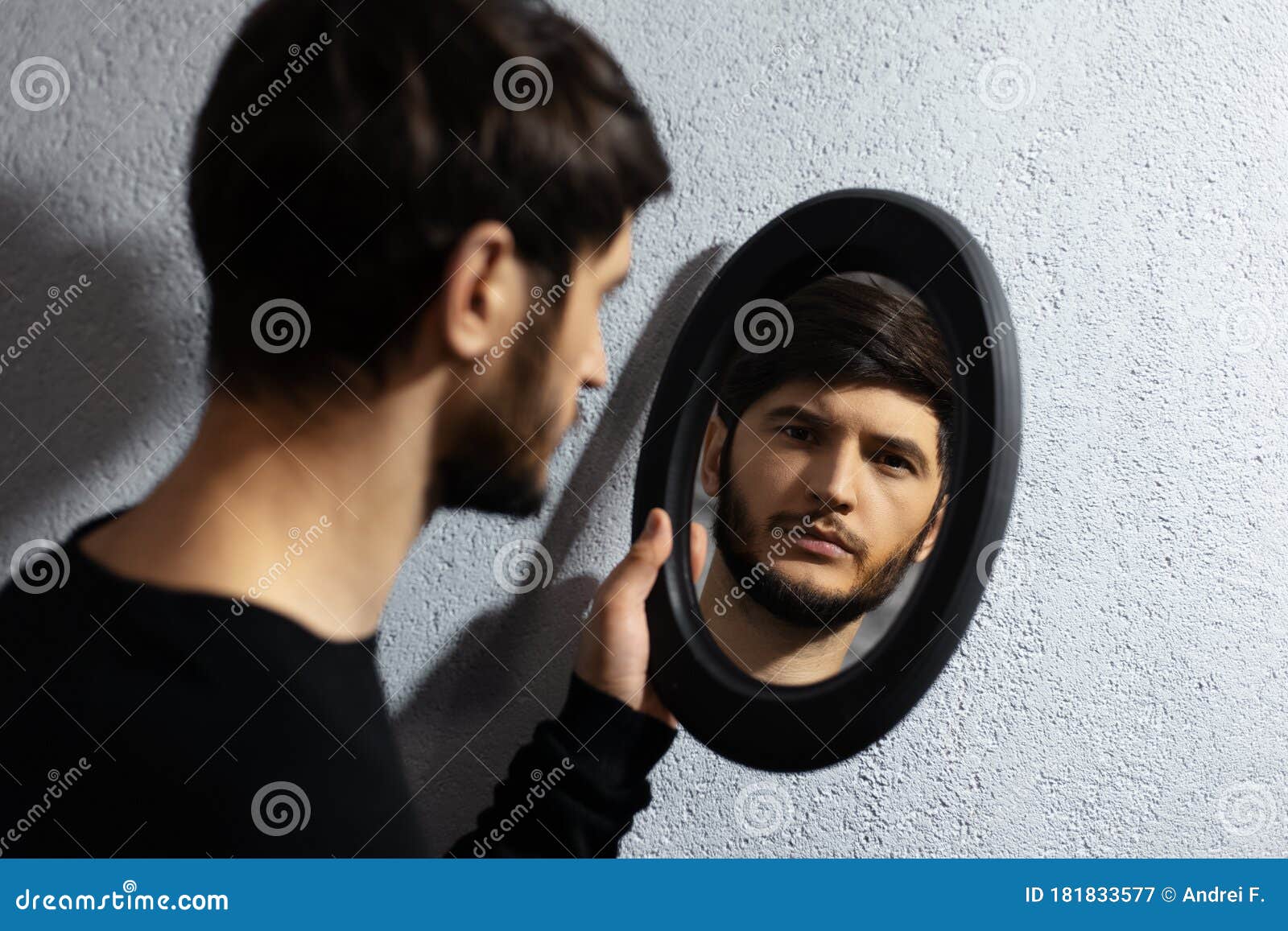 Dramatic Portrait of Young Man Looking in the Mirror. Stock Image ...