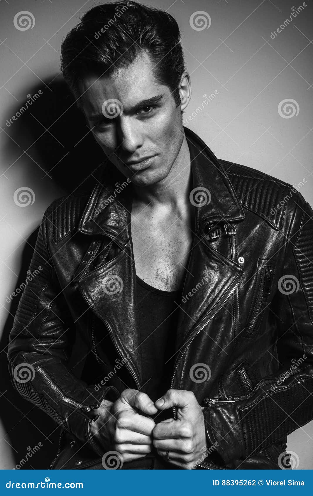 Dramatic Portrait of a Young Man Pulling His Leather Jacket Stock Photo ...