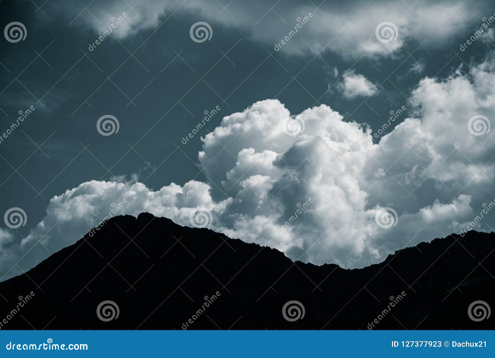 Dramatic Rain Clouds Over the Mountain Top Silhouette. Mountain ...