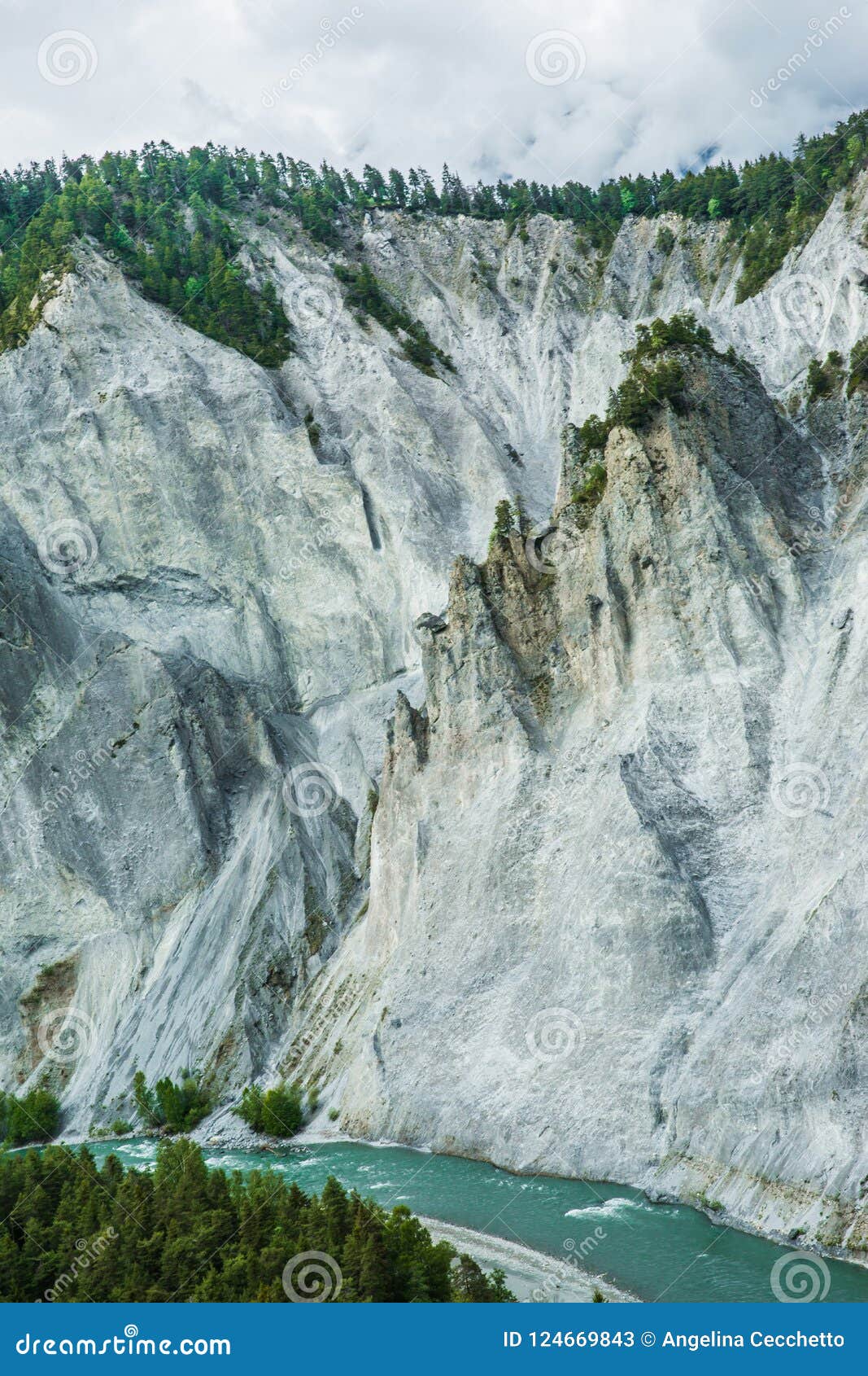 Dramatic and Rugged Rocky Mountains Cliffs with Green Forest and Stock ...