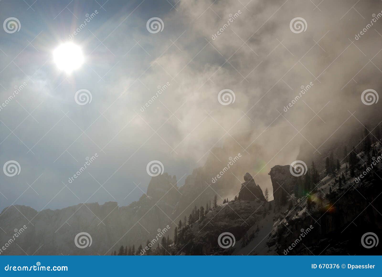 Dramatic Scene with Sun, Clouds and Rocks Stock Photo - Image of alps ...
