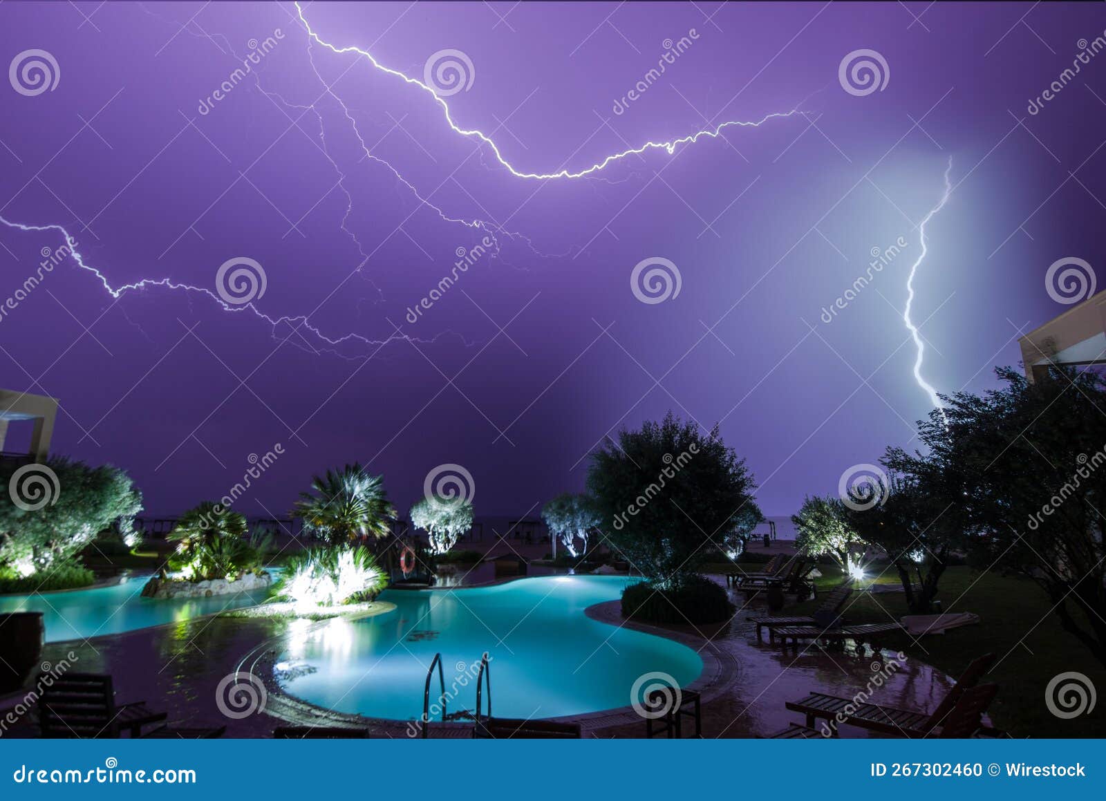 Dramatic Shot of Lightning Over the Pool Illuminated by Lights Stock ...