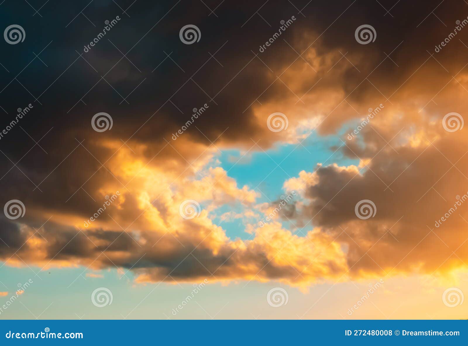 Dramatic Sky. Dark Cumulus Clouds in Sunlight on a Light Blue ...