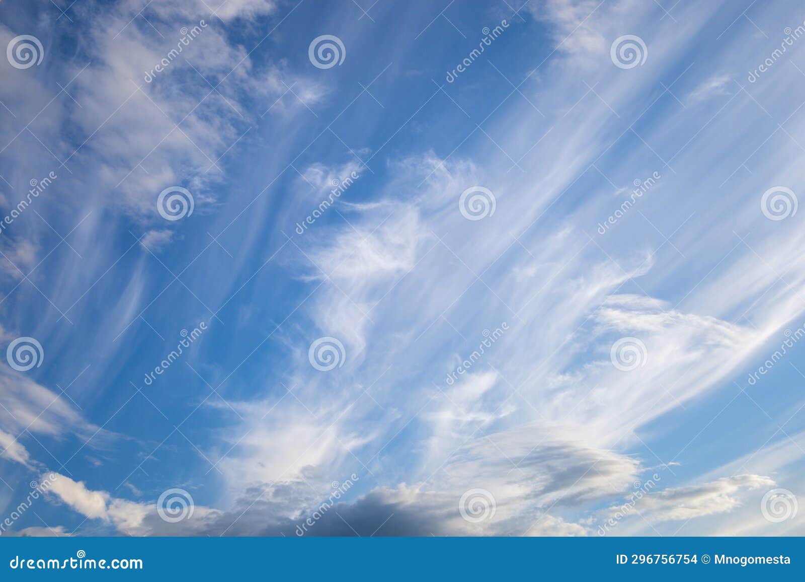A Dramatic Sky with Majestic Cirrus Clouds Stretched Across a Blue Dome ...